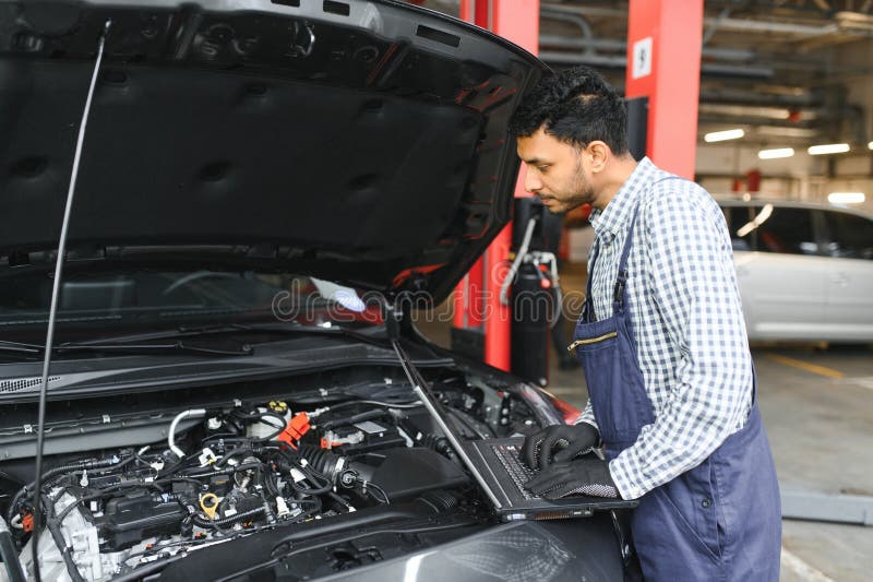 Mechanic Man Mechanic Manager Worker Using a Laptop Computer Checking ...