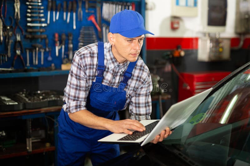 Mechanic Man with Laptop Making Car Diagnostics at Service Stock Image ...