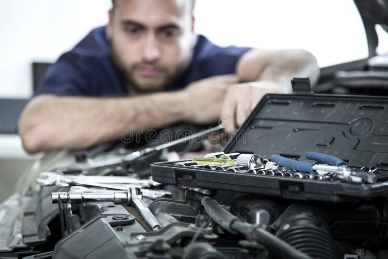 Mechanic man working stock image. Image of handsome, repairing - 92998285