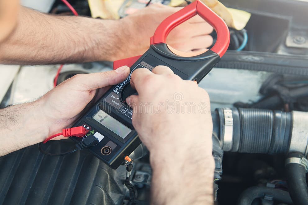Mechanic with a Multimeter Testing Car Engine. Car Service Stock Photo ...