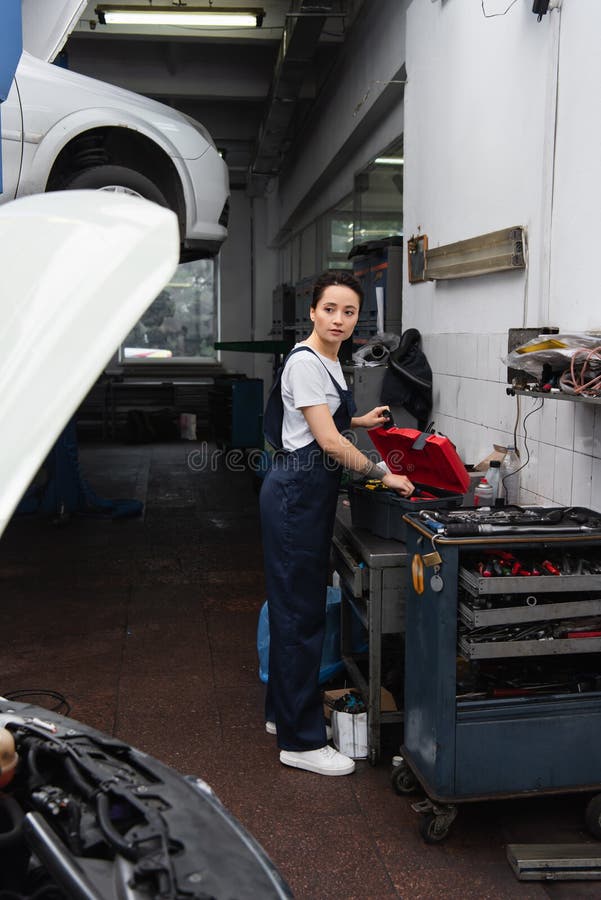 Mechanic Opening Toolbox and Looking at Stock Photo - Image of mechanic ...