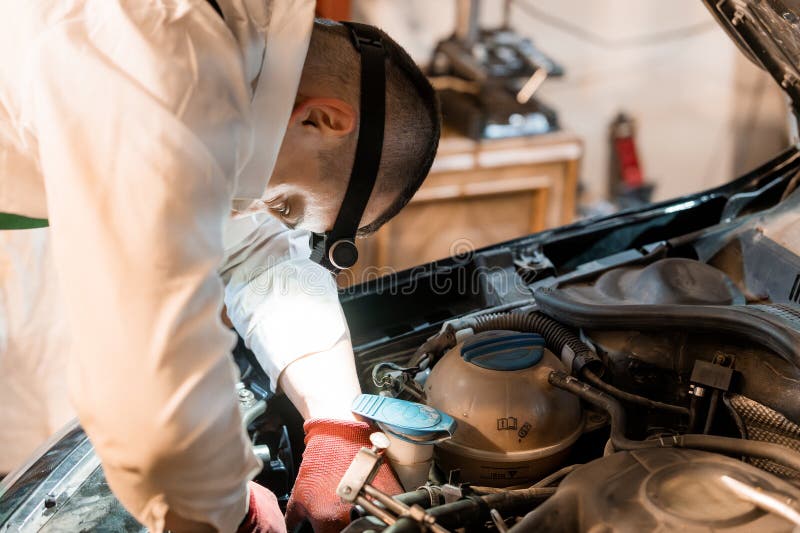 Mechanic Performing Engine Maintenance with Precision and Care Stock ...