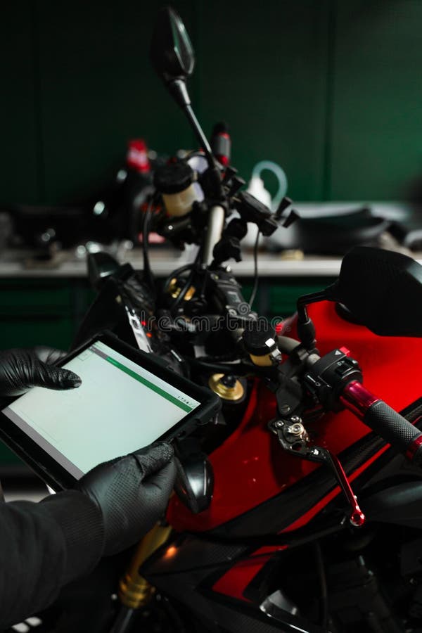 Mechanic Performing System Diagnostics Via Tablet. Motorcycle System ...