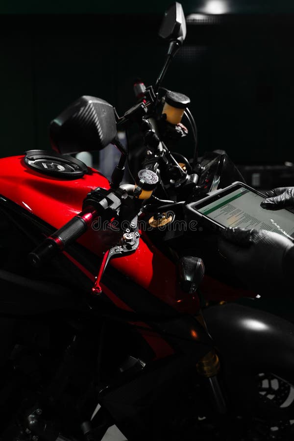 Mechanic Performing System Diagnostics Via Tablet. Motorcycle System ...