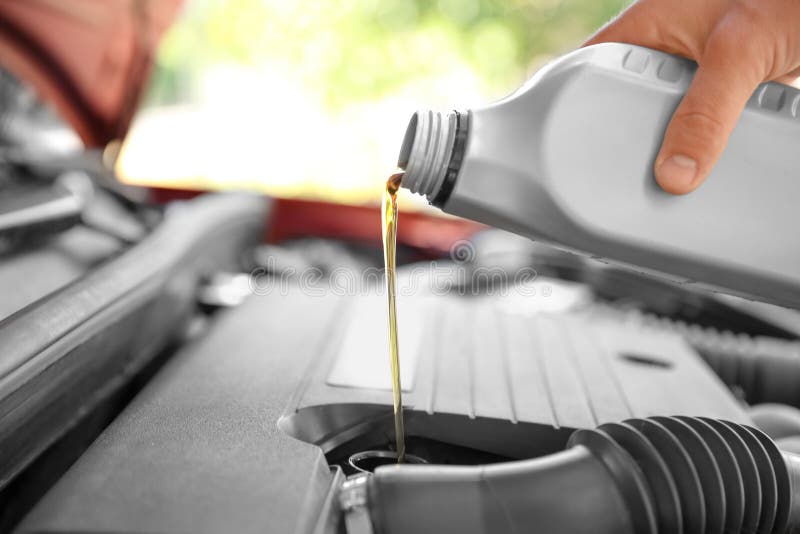 Pouring Oil into Car Engine Stock Photo - Image of lubricant ...