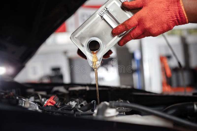 Mechanic is Pouring Oil into Engine. Stock Image - Image of service ...