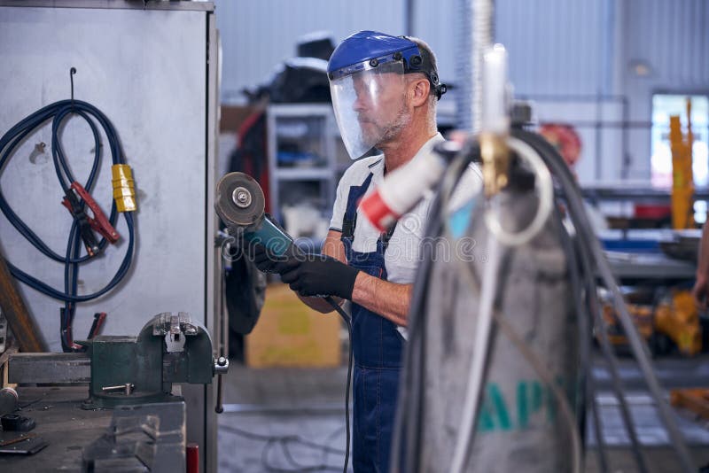 Male Worker Protective Mask Using Grinder Garage Stock Photos - Free ...