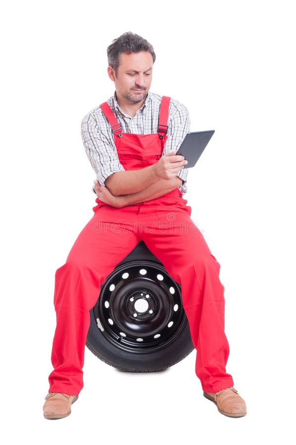 Mechanic Reading from Wireless Tablet Stock Image - Image of ...