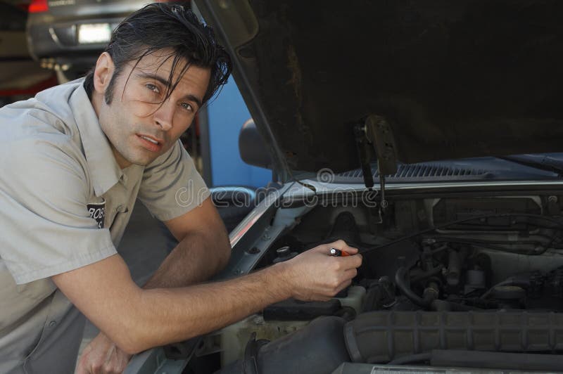 Mechanic Repairing Car Engine Stock Photo - Image of service, leaning ...