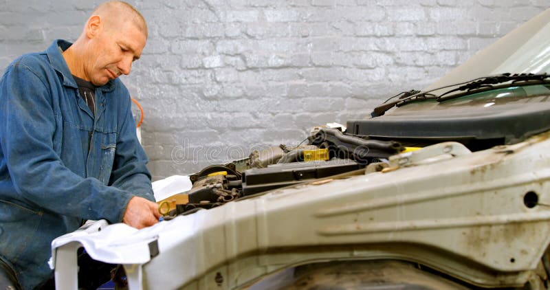 Mechanic Repairing a Car Engine 4k Stock Footage - Video of garage ...
