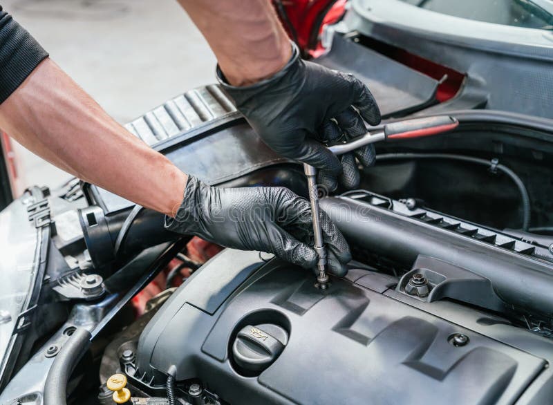 Mechanic Repairing Car Engine Using Ratchet Socket Stock Photos - Free ...