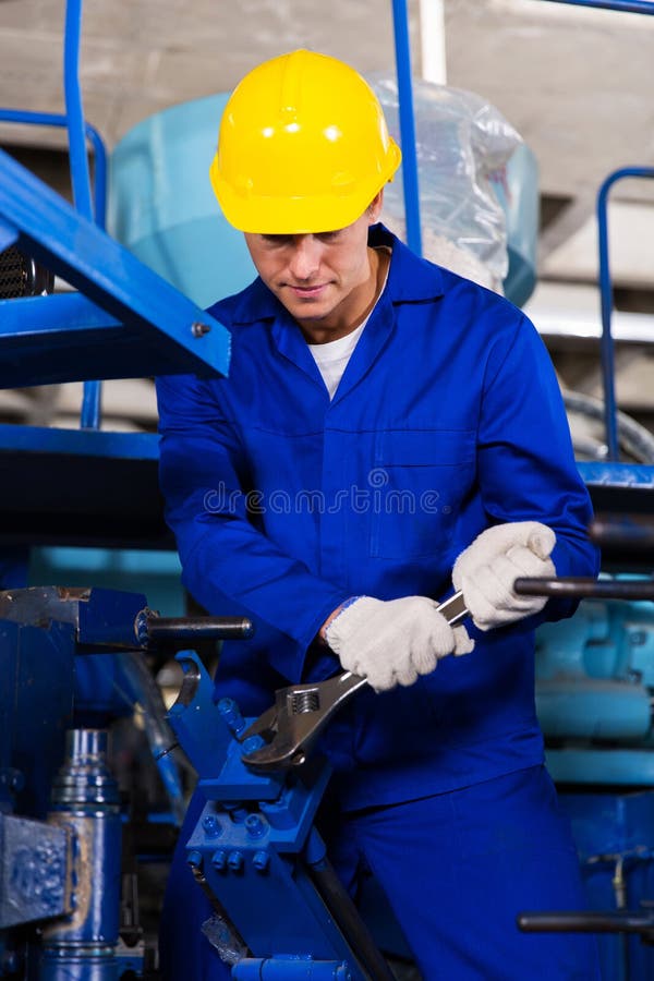 Mechanic Repairing Sewing Machine Stock Image - Image of studio, helmet ...