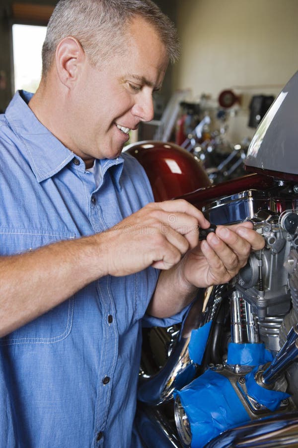 Mechanic Repairing Motorcycle Engine Stock Image - Image of service ...
