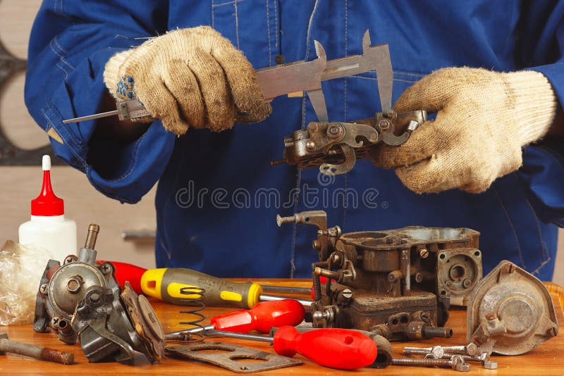 Mechanic Repairing Parts Engine in the Workshop Stock Photo - Image of ...
