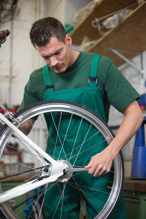 Bicycle repair shop editorial photo. Image of worker - 21308271