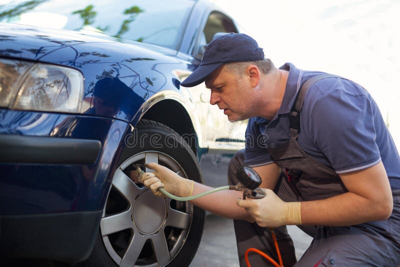 Mechanic Repairman Making Tyre in Workshop Stock Photo - Image of ...