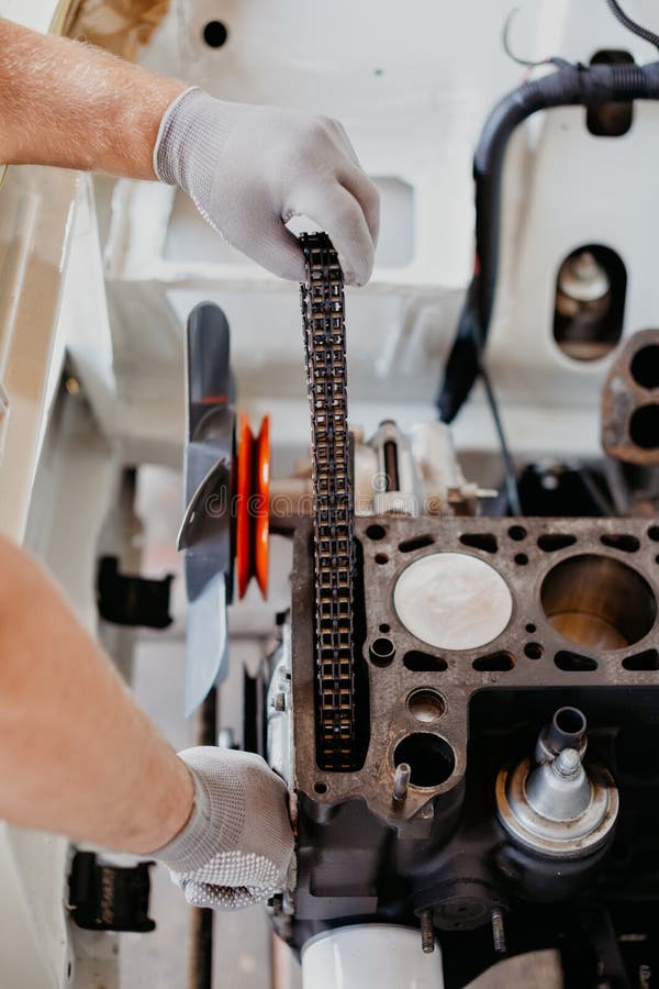 The Mechanic Replaces the Timing Chain on the Four-cylinder Engine ...