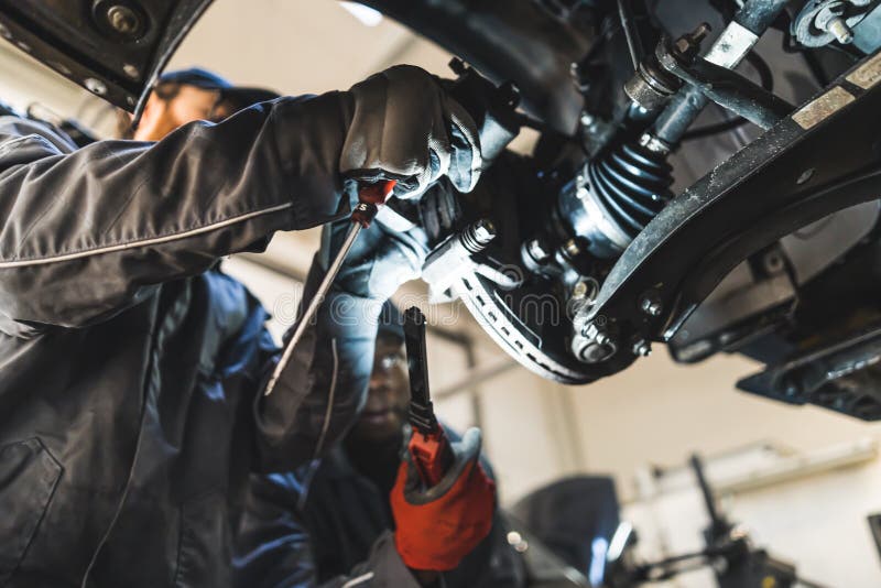Mechanic Replacing Car Wheel Using Different Modern Tools in Car Repair ...