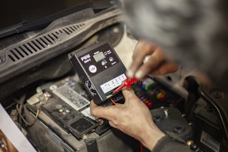 Mechanic`s Hands Adjust the Hydrogen System Control Unit in the Car ...