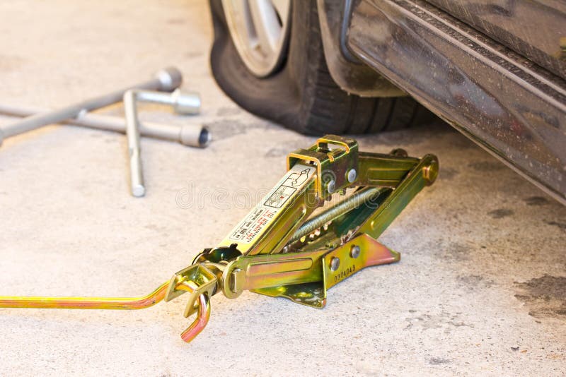 Mechanic Sets a Jack-screw. Stock Image - Image of repair, lift: 30828147
