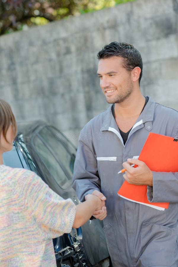 Mechanic Shaking Hands with Customer Stock Image - Image of customer ...