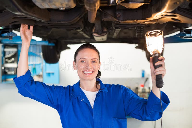 Mechanic Shining Torch Under Car Stock Photo - Image of happy, torch ...