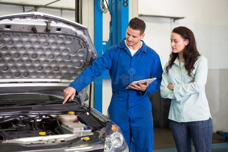 Mechanic Showing Customer the Problem with Car Stock Photo - Image of ...