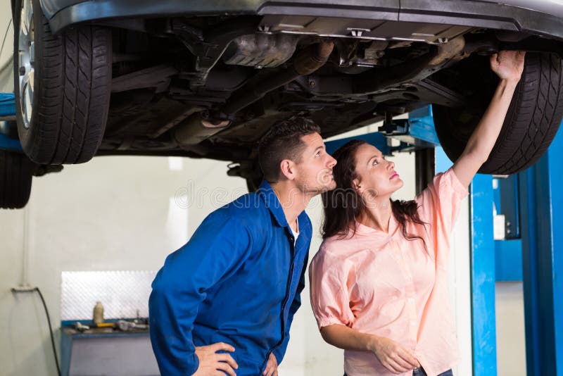 Mechanic Showing Customer the Problem with Car Stock Photo - Image of ...