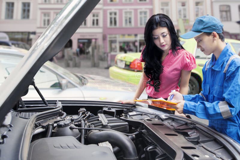 Mechanic Shows the Car Problem on His Client Stock Photo - Image of ...