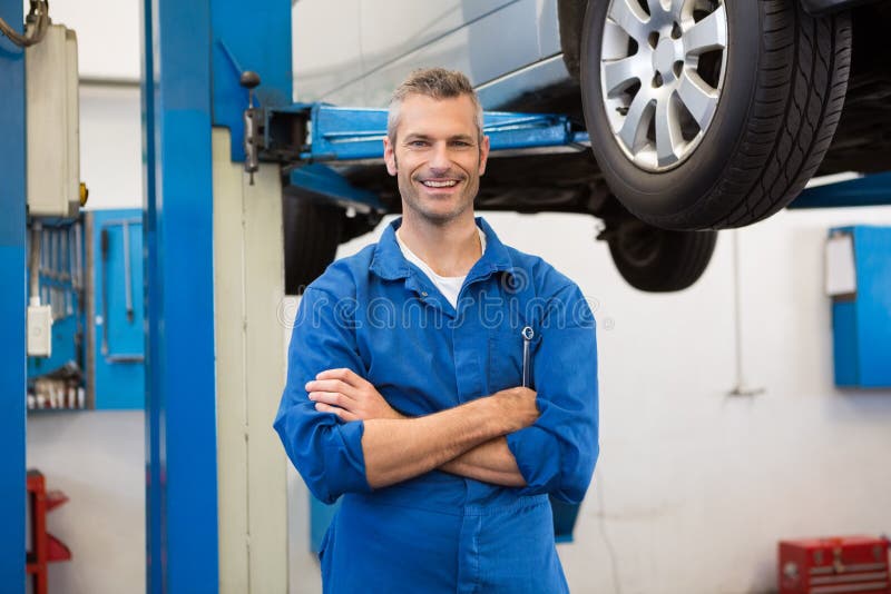 Mechanic Smiling at the Camera with Customer Stock Photo - Image of ...