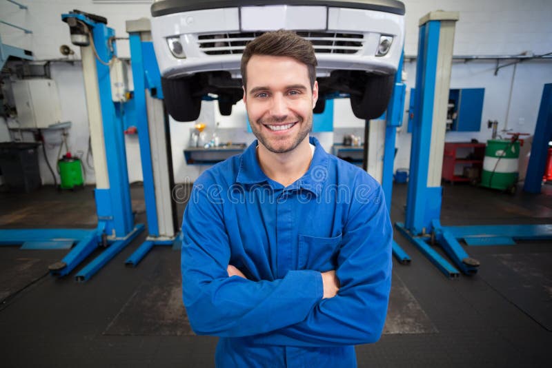 Mechanic Smiling at the Camera Stock Image - Image of cheerful, arms ...