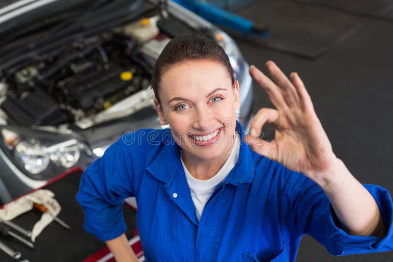 Mechanic Smiling Up at Camera Stock Photo - Image of positive ...