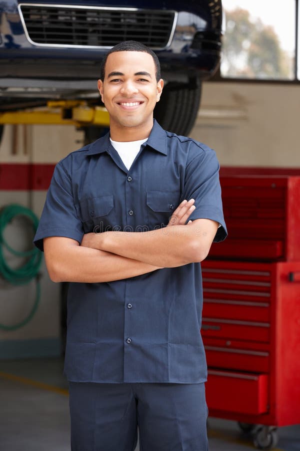 Mechanic Standing in Front of Car Stock Photo - Image of person, race ...