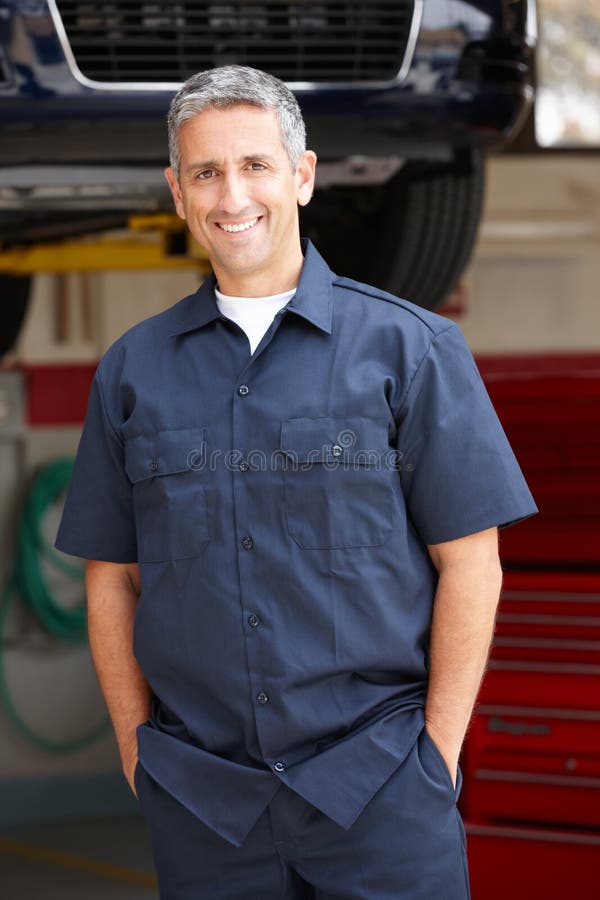 Mechanic Standing in Front of Car Stock Photo - Image of confident ...