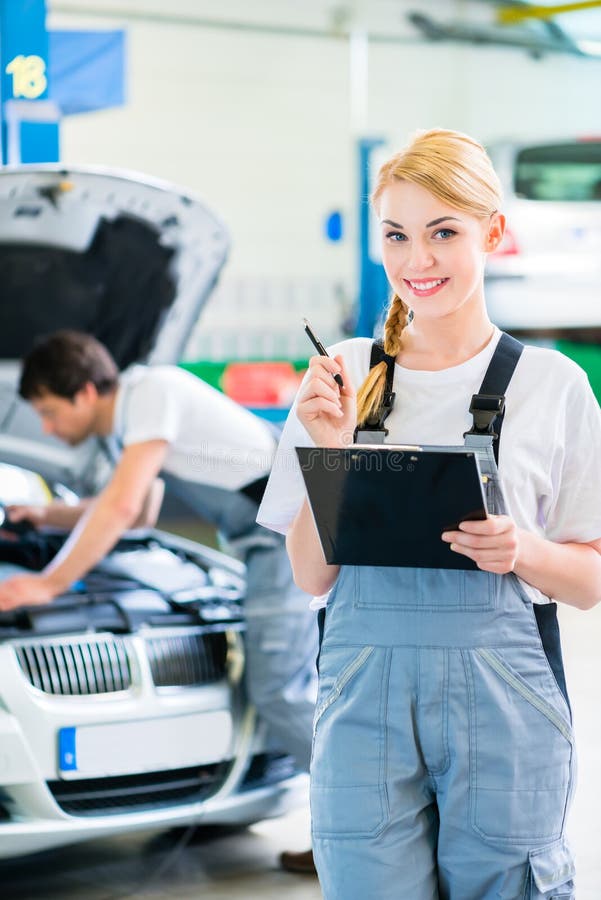Mechanic Team Working in Car Workshop Stock Image - Image of team ...