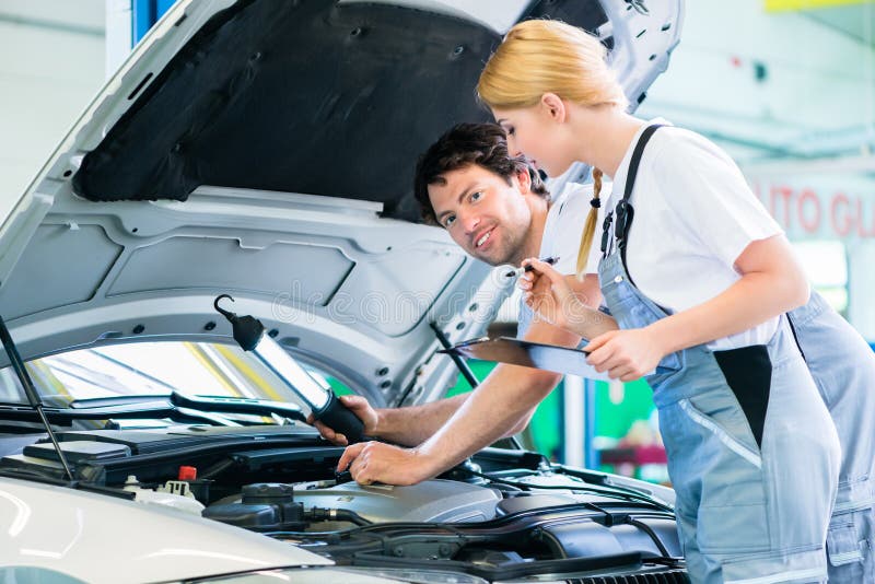 Mechanic Team Working in Car Workshop Stock Image - Image of team ...