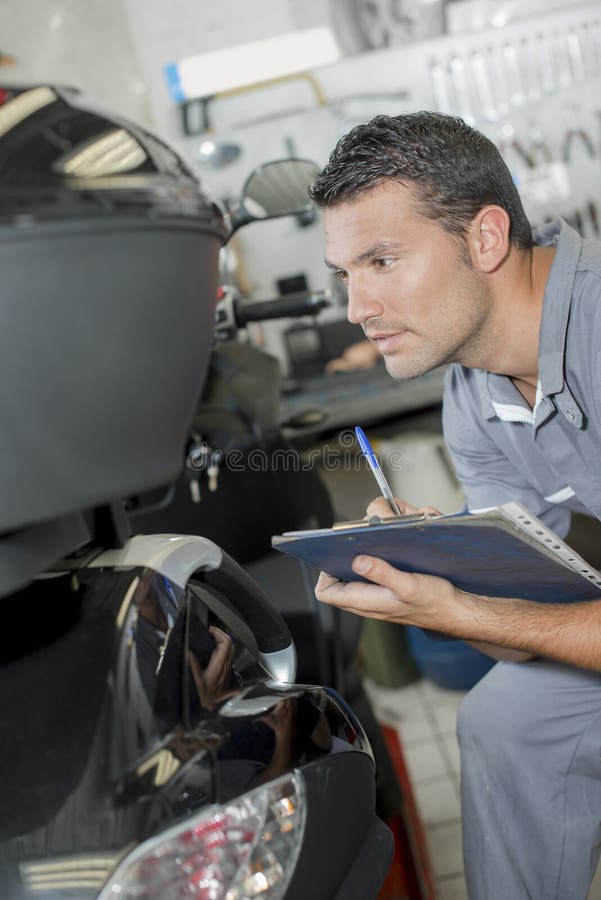 Mechanic testing a car stock image. Image of station - 150199019