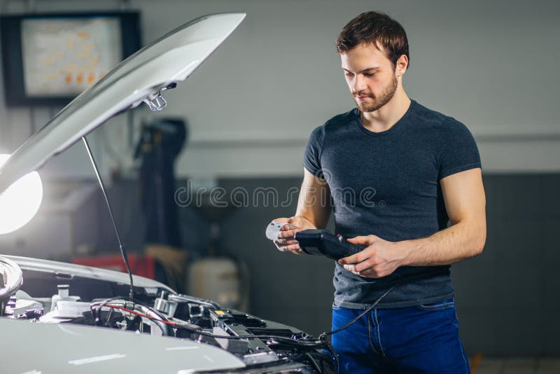 Mechanic Testing Electrical System on Automobile Editorial Photography ...