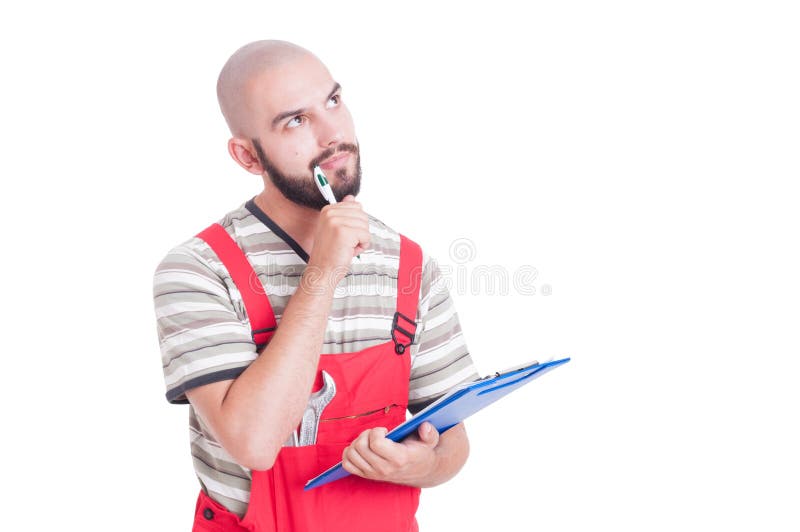 Mechanic Thinking Holding a Clipboard and Pen Stock Photo - Image of ...