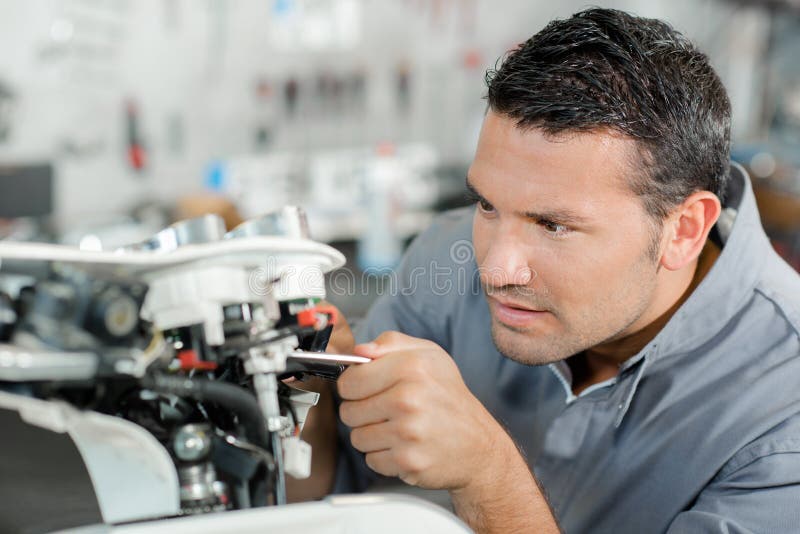 Mechanic tightening a bolt stock photo. Image of mechanical - 127762794