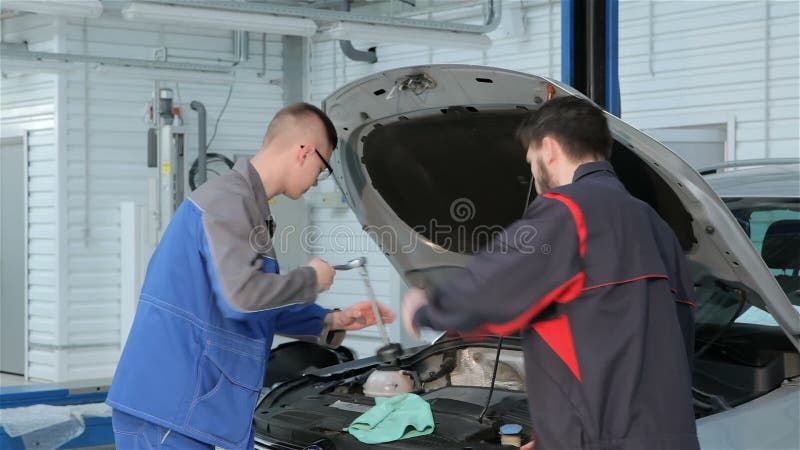Mechanic Troubleshoots Car Problem at the Car Service Stock Footage ...