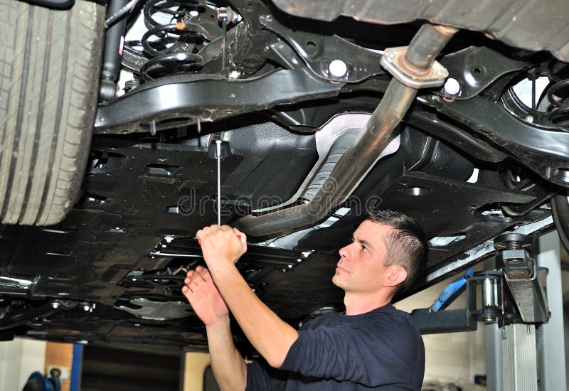 Mechanic under car. stock image. Image of diagnostic - 35676479