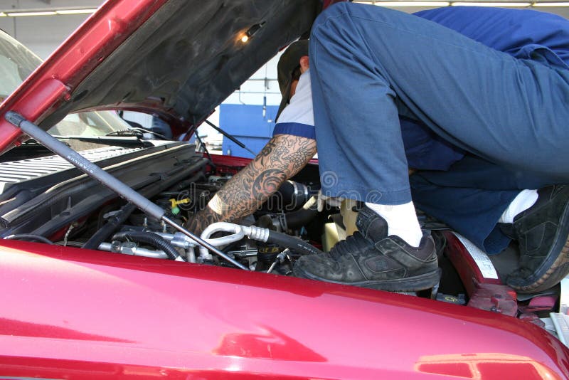 Mechanic under the hood stock image. Image of technician - 839289