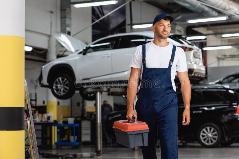 Mechanic in Uniform and Cap Holding Stock Photo - Image of auto ...
