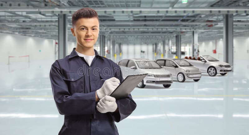 Mechanic in a Uniform Writing a Document Stock Image - Image of ...