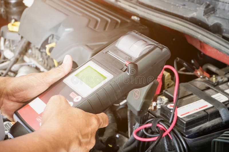 Checking the Voltage with an Ammeter in an Old Computer on the Table ...