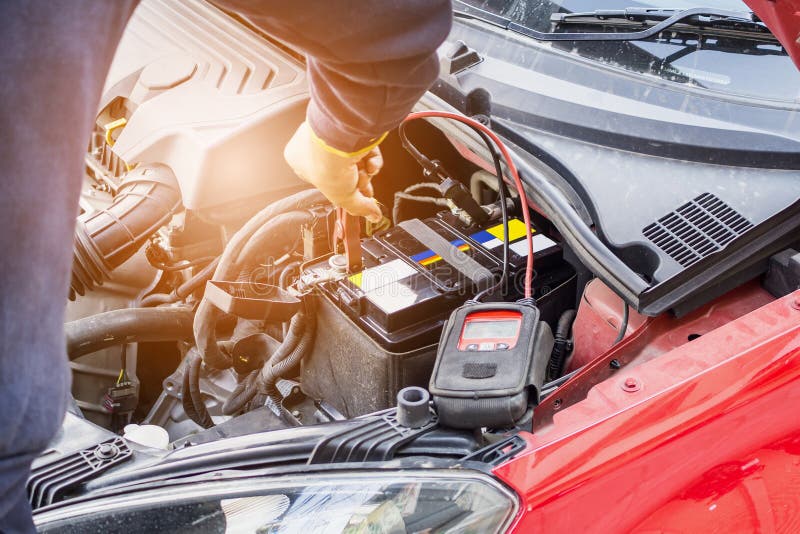 Mechanic Use Voltmeter Checking Voltage of Car Battery Stock Image ... Mechanic Use Voltmeter Checking Voltage of Car Battery Stock Image ...
