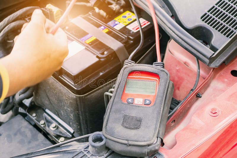 Mechanic Use Voltmeter To Check Car Battery Voltage Level Stock Photo ... Mechanic Use Voltmeter To Check Car Battery Voltage Level Stock Photo ...