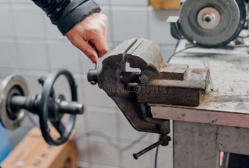The Mechanic Uses the Vise in the Garage Stock Photo - Image of ...