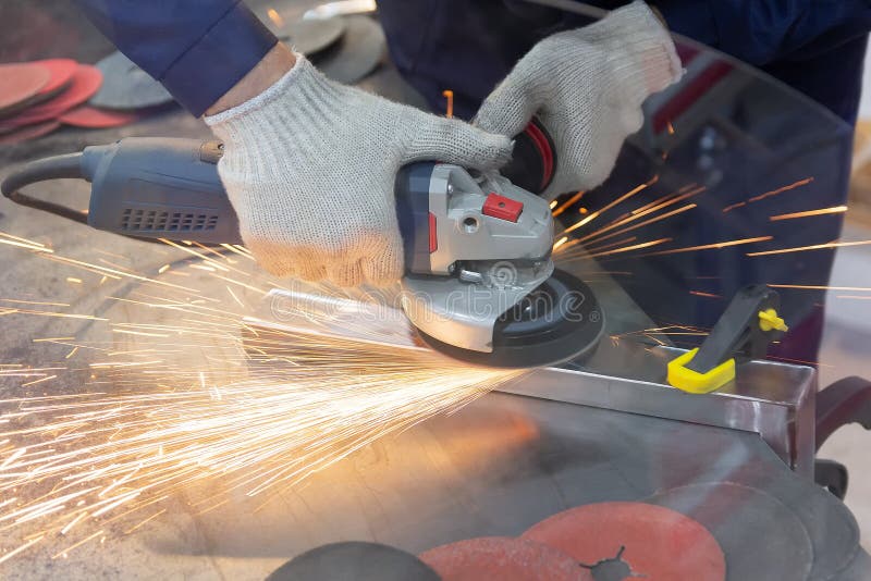 Mechanic Using Angle Grinder and Working with Metal in Workshop Stock ...